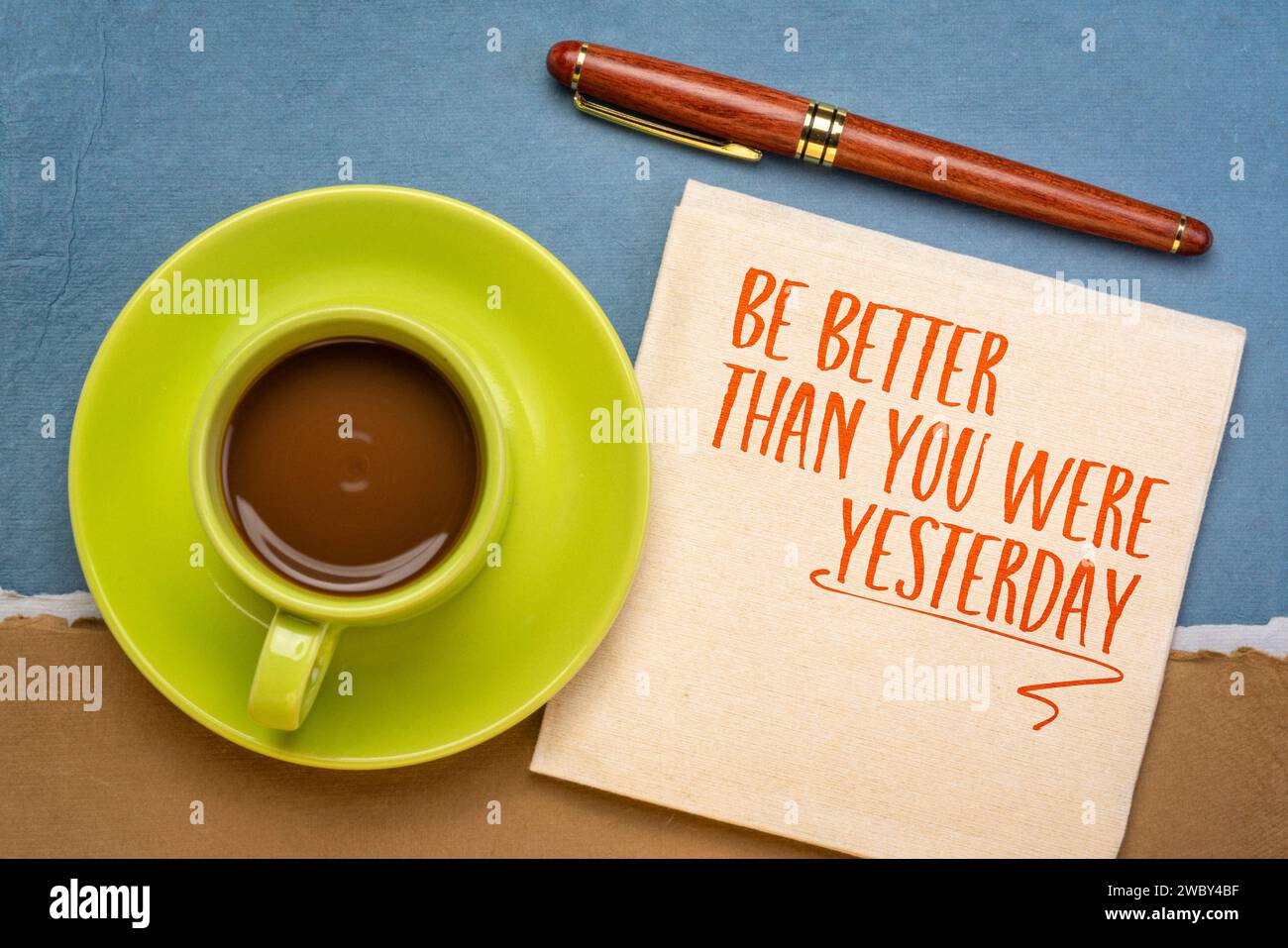 Be better than you were yesterday - motivational text on a napkin with ...