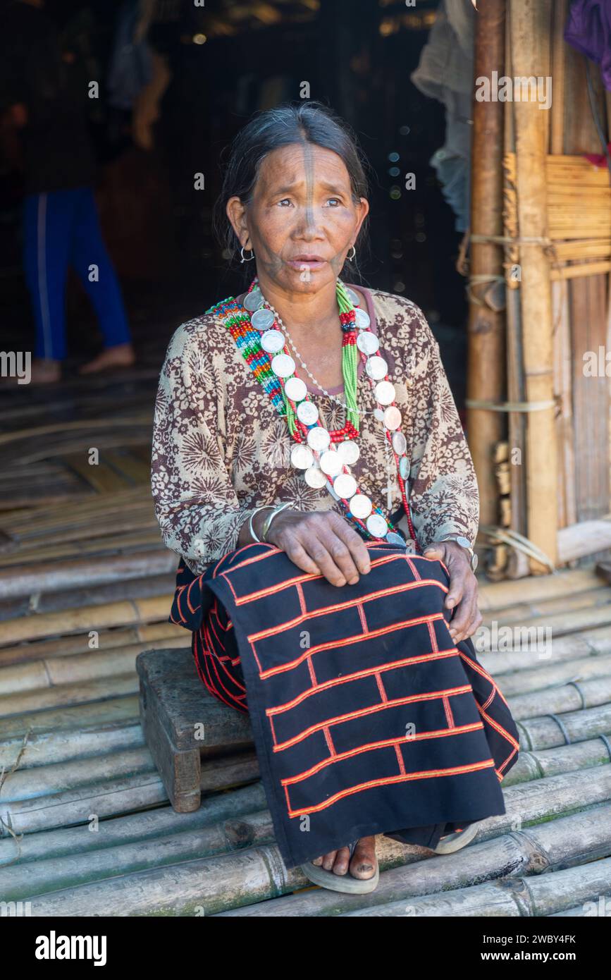 Seated Ollo Nocte woman with facial tattooes, Lazu Village, Arunachal ...