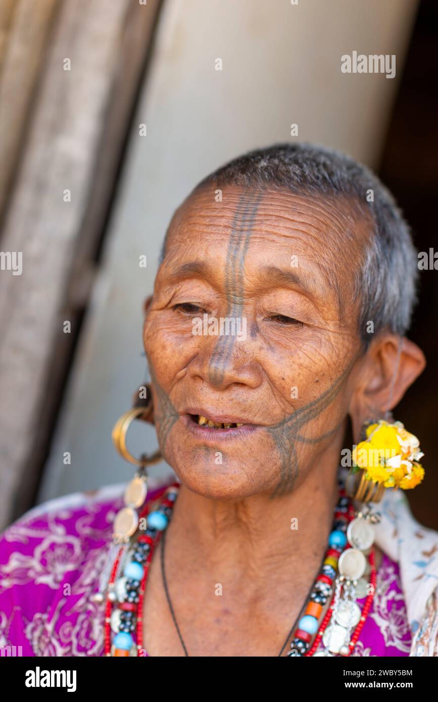 Portrait of a Ollo Nocte old woman with facial tattooes, Lazu village ...
