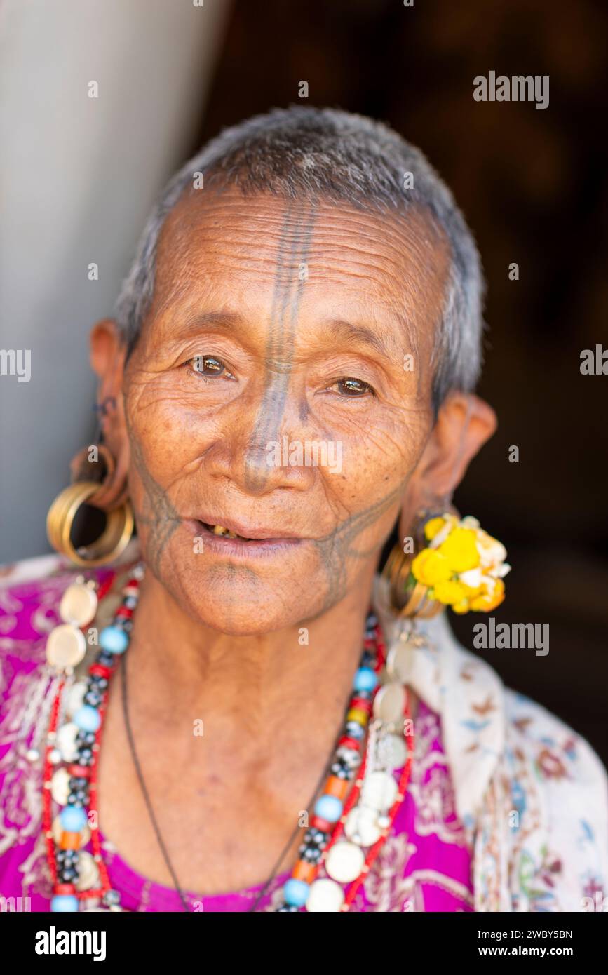 Portrait of a Ollo Nocte old woman with facial tattooes, Lazu village ...