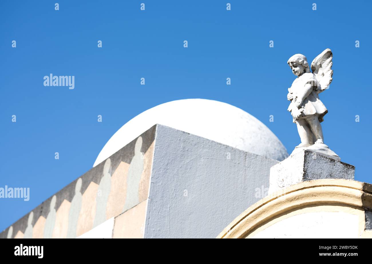 angel statue looking down with copy space Stock Photo - Alamy