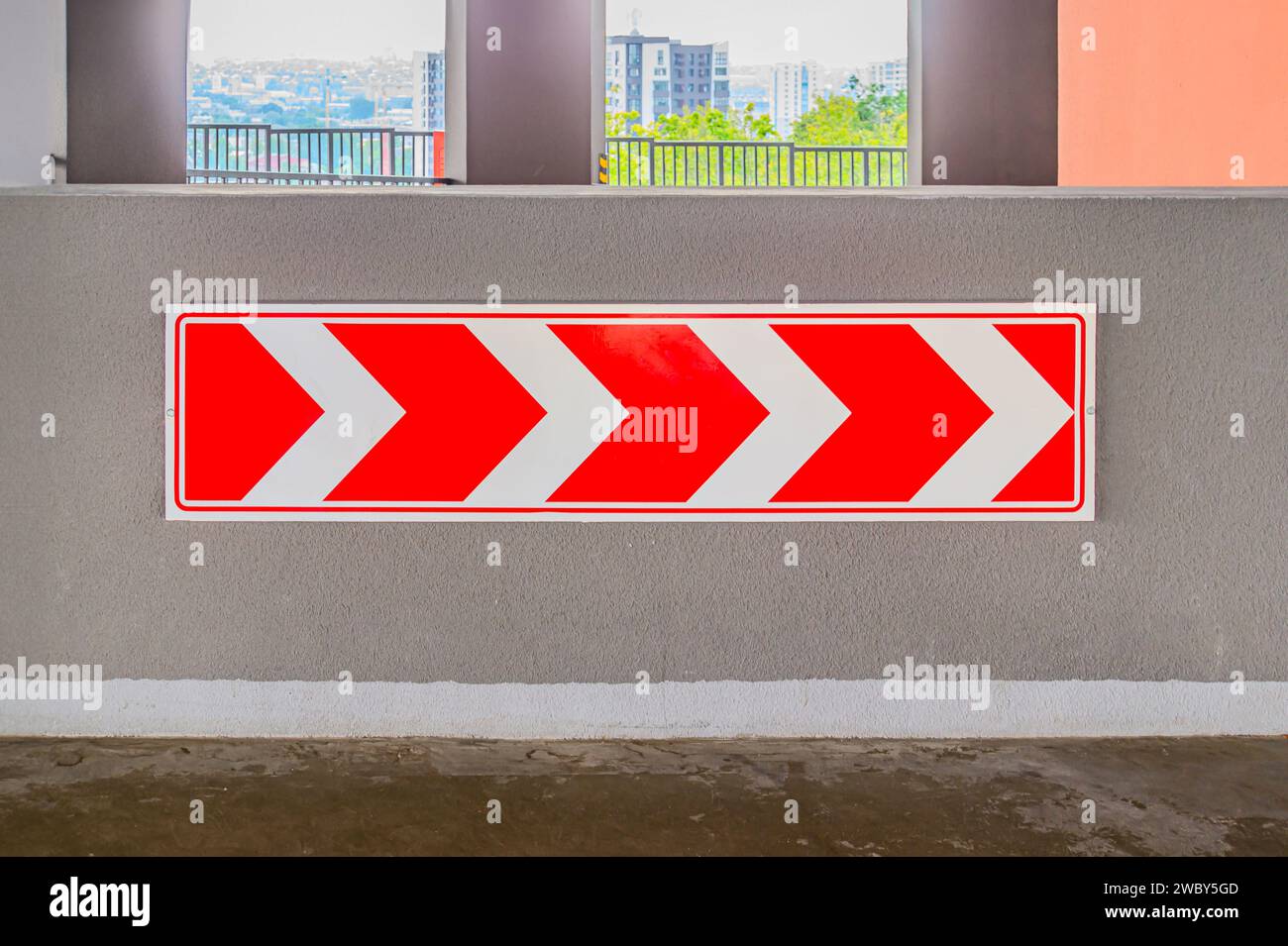 Sign for diverting traffic and tyres as obstacles on a road ...