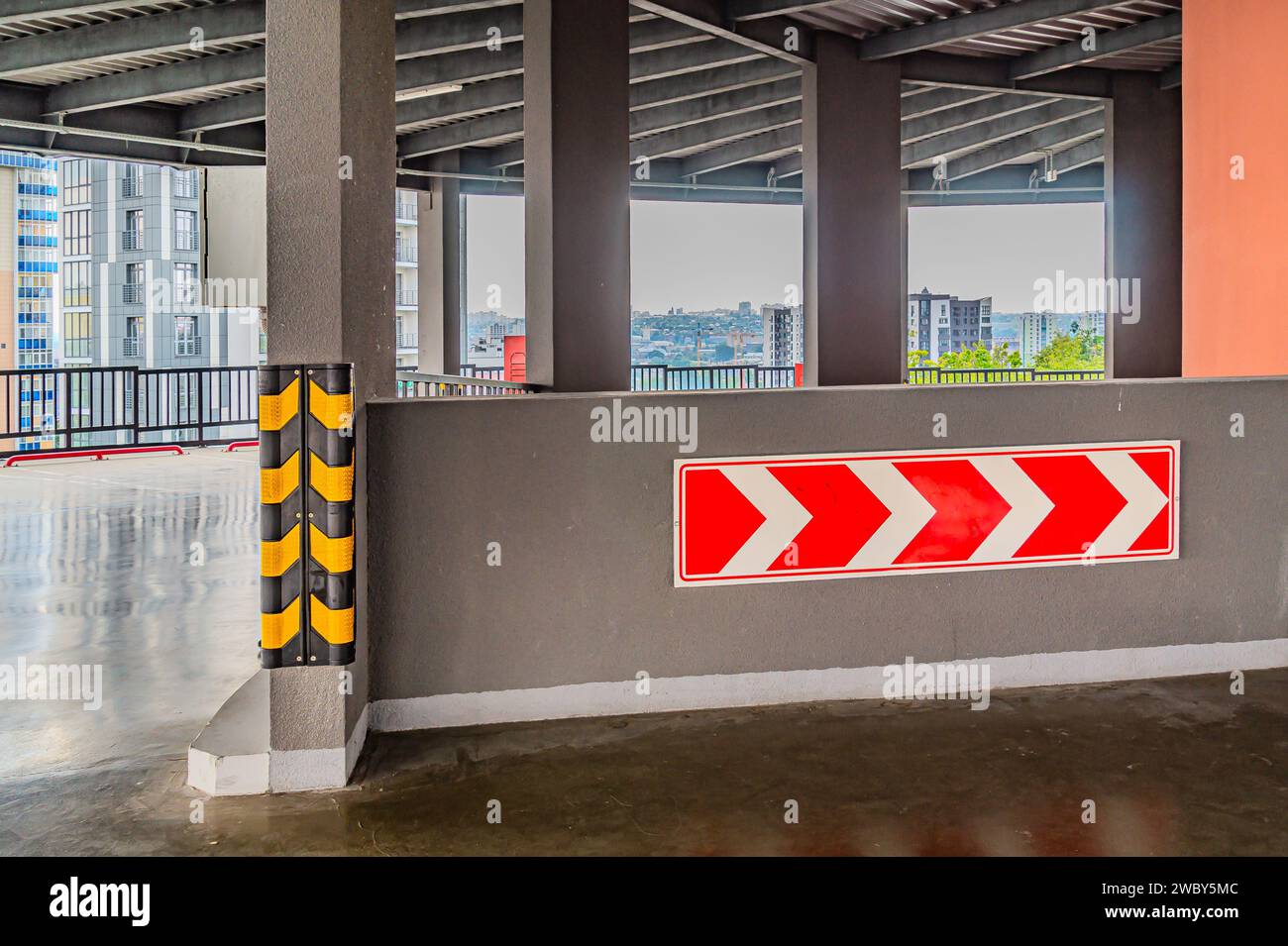 Sign for diverting traffic and tyres as obstacles on a road ...