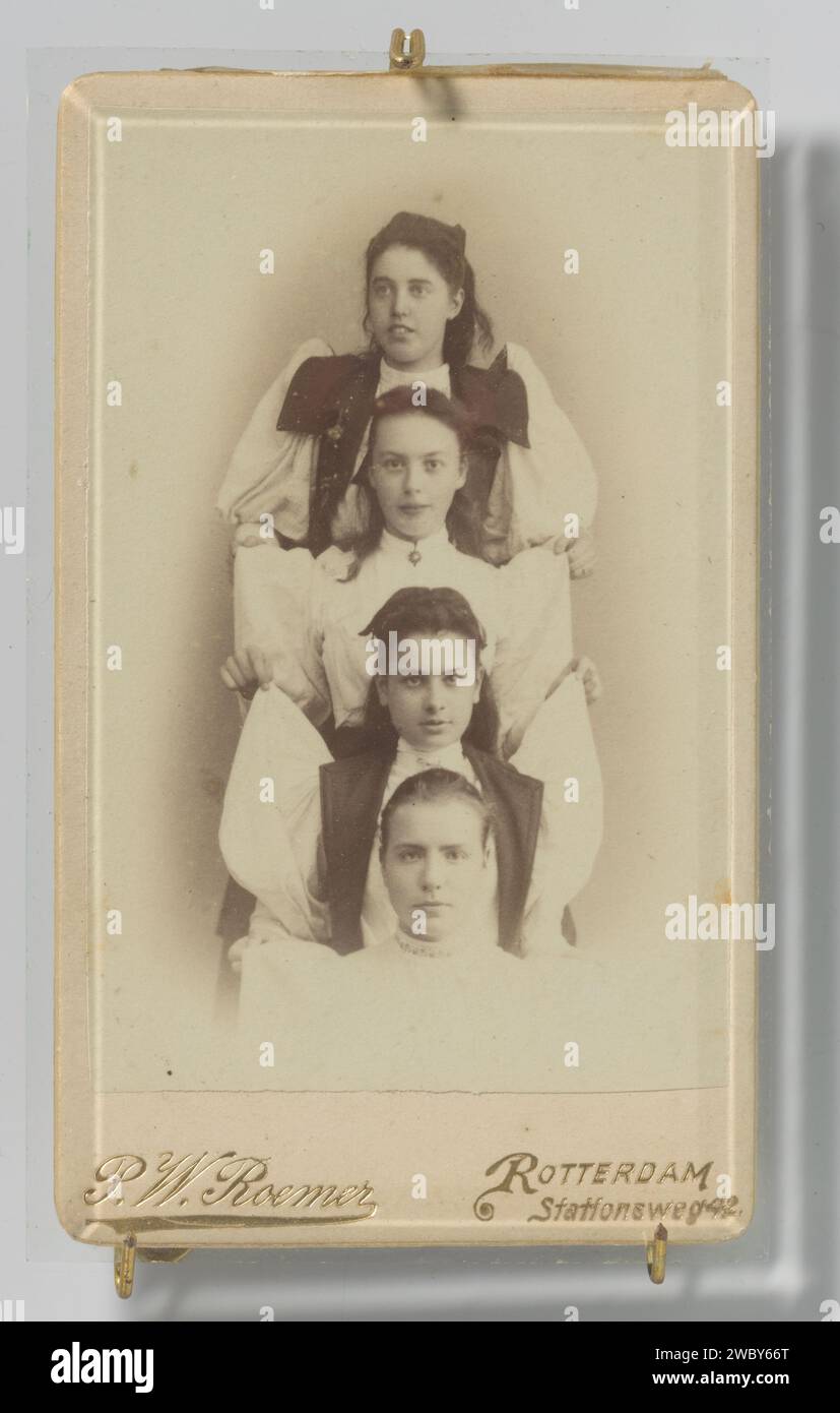 Group portrait of four unknown girls, standing one after the other ...