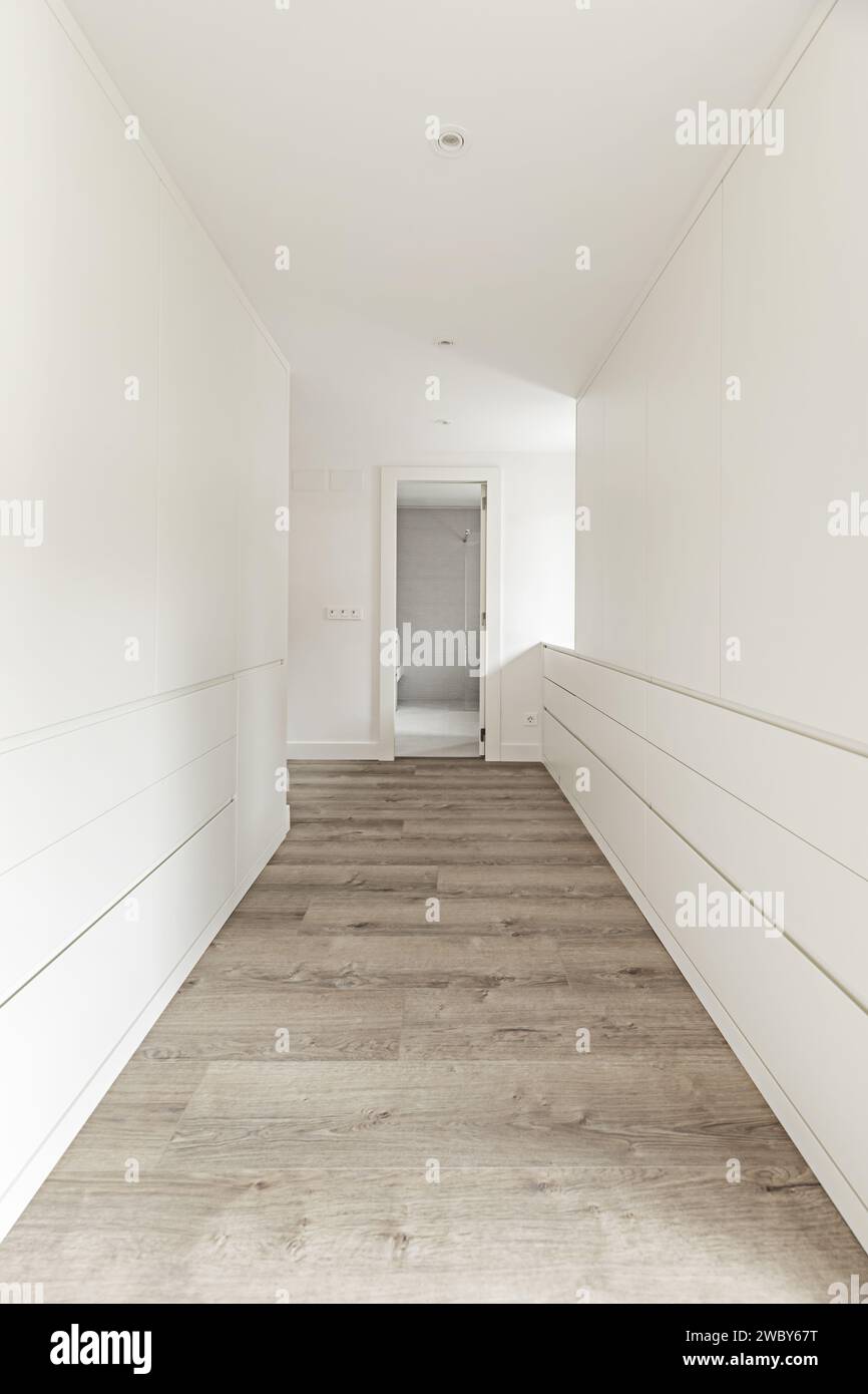 Hallway to a dressing room in a newly renovated bedroom with built-in ...
