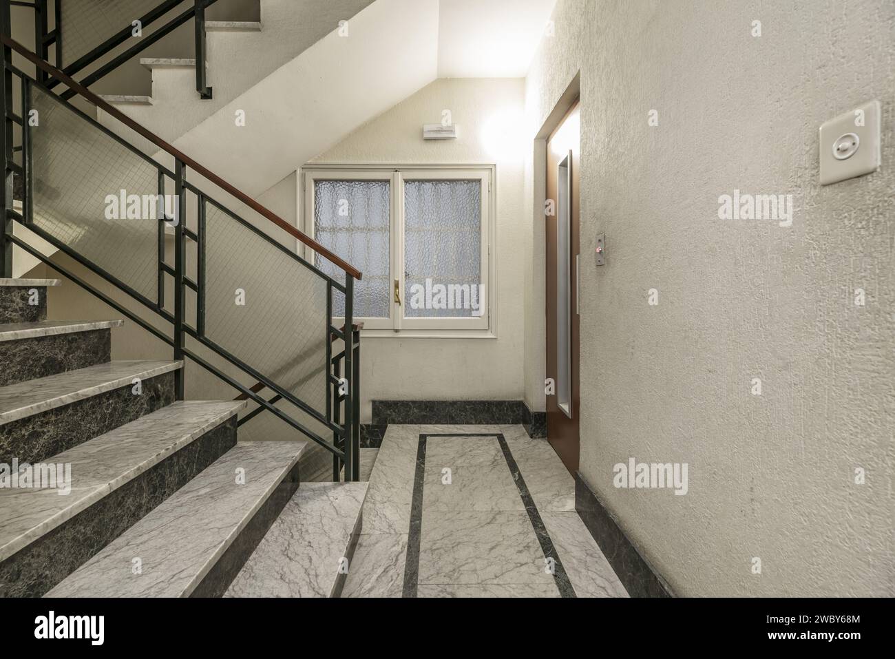 Stairs of a residential building built in the 70s with white marble ...
