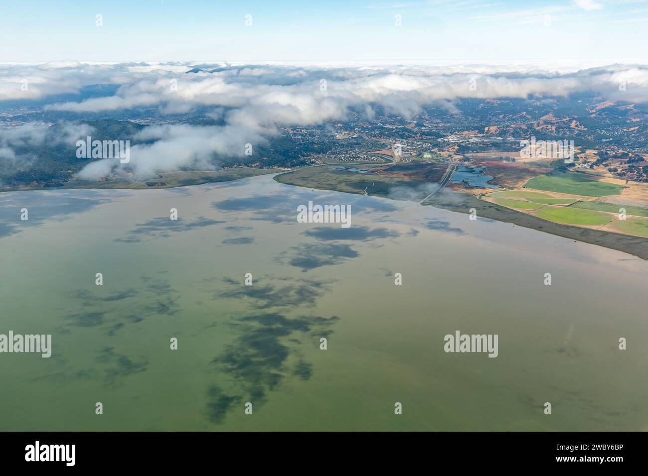 Aerial view of clouds over agricultural fields and northern San ...