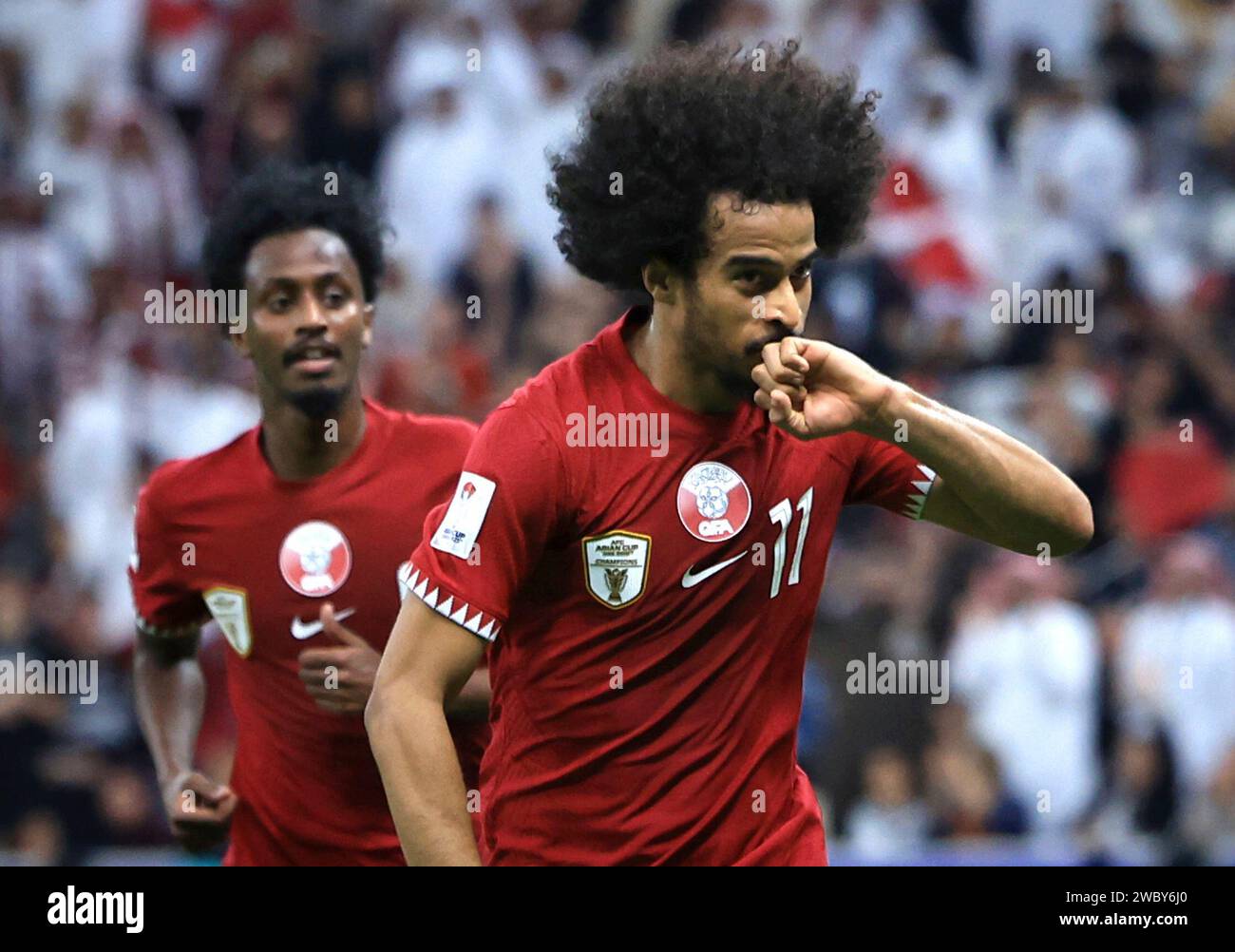 Akram Afif of Qatar reacts after scoring an opener during AFC Asian Cup ...