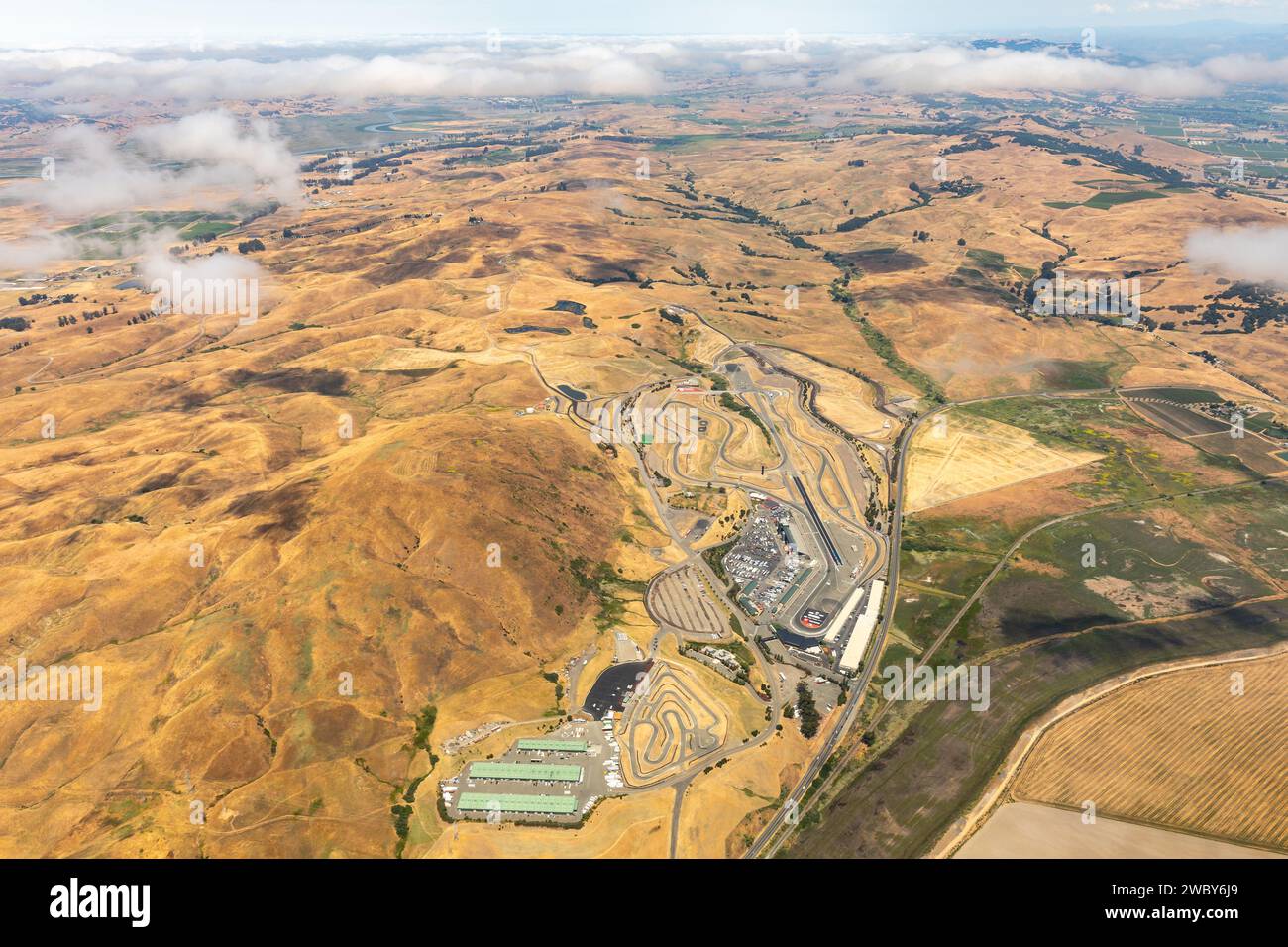 Aerial view of Sonoma Raceway in the golden grass fields and vinyards ...
