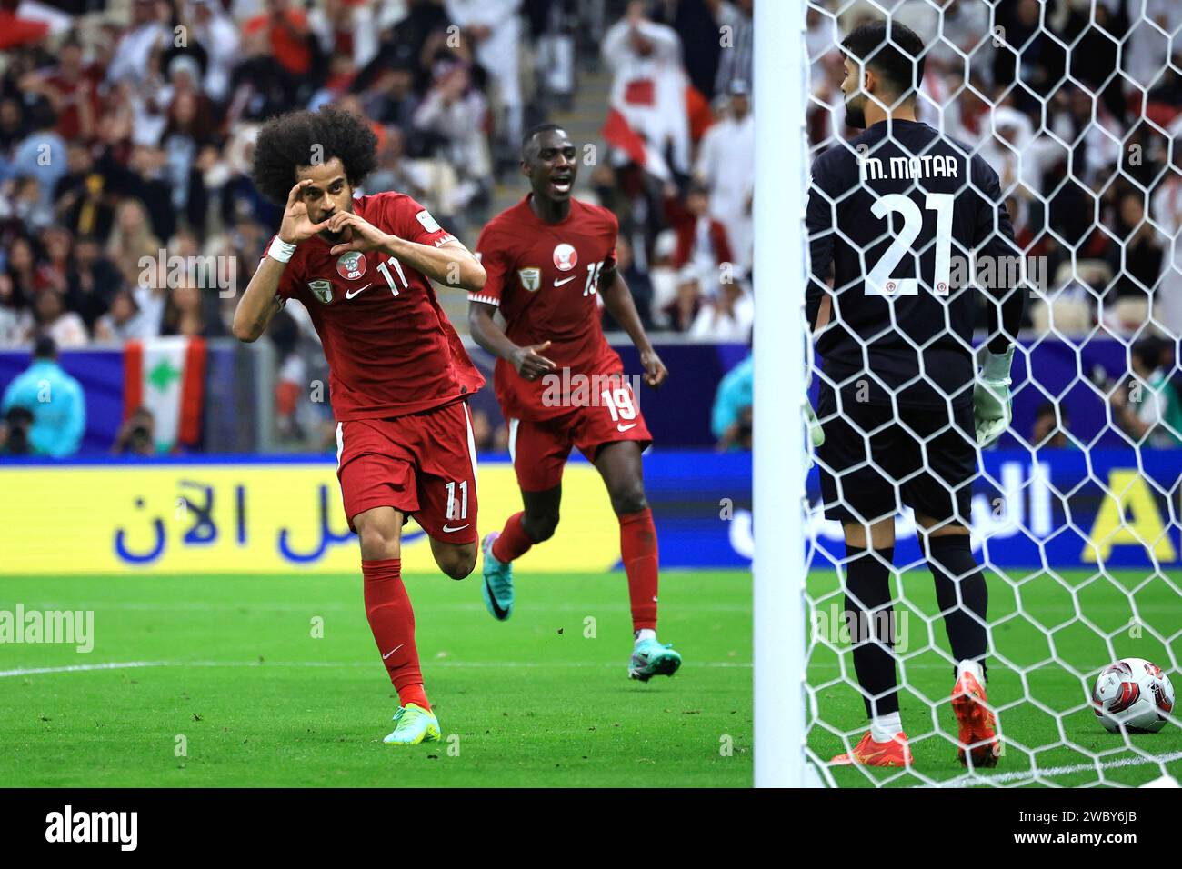 Akram Afif of Qatar reacts after scoring an opener during AFC Asian Cup ...