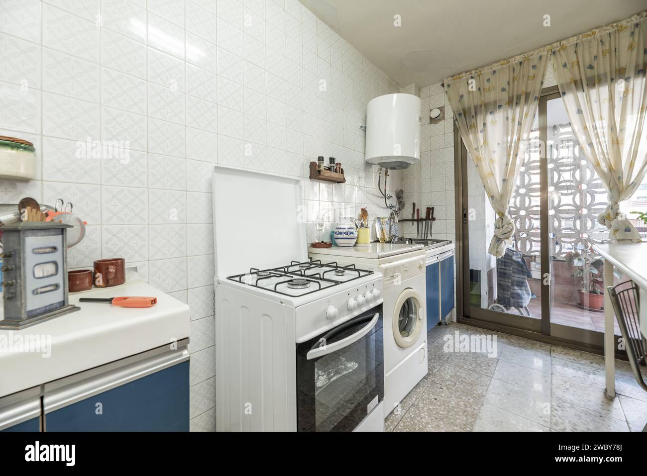 Minimalist conventional kitchen with individual appliances, terrazzo ...