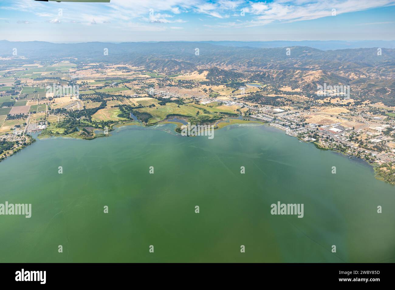 Aerial view of the polluted green waters of Clear Lake and the ...