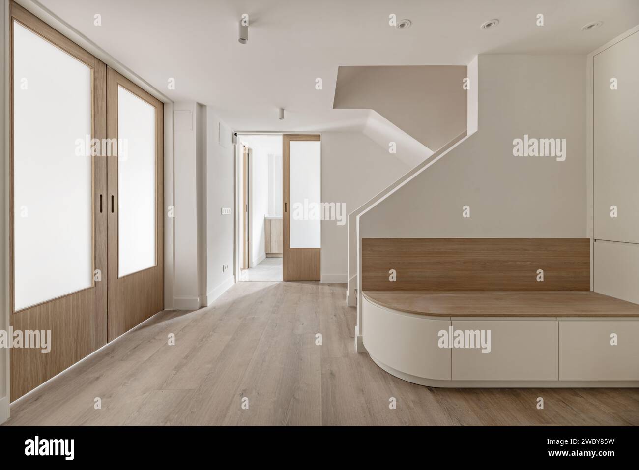 A large hall of a recently renovated modern house with a white oak ...