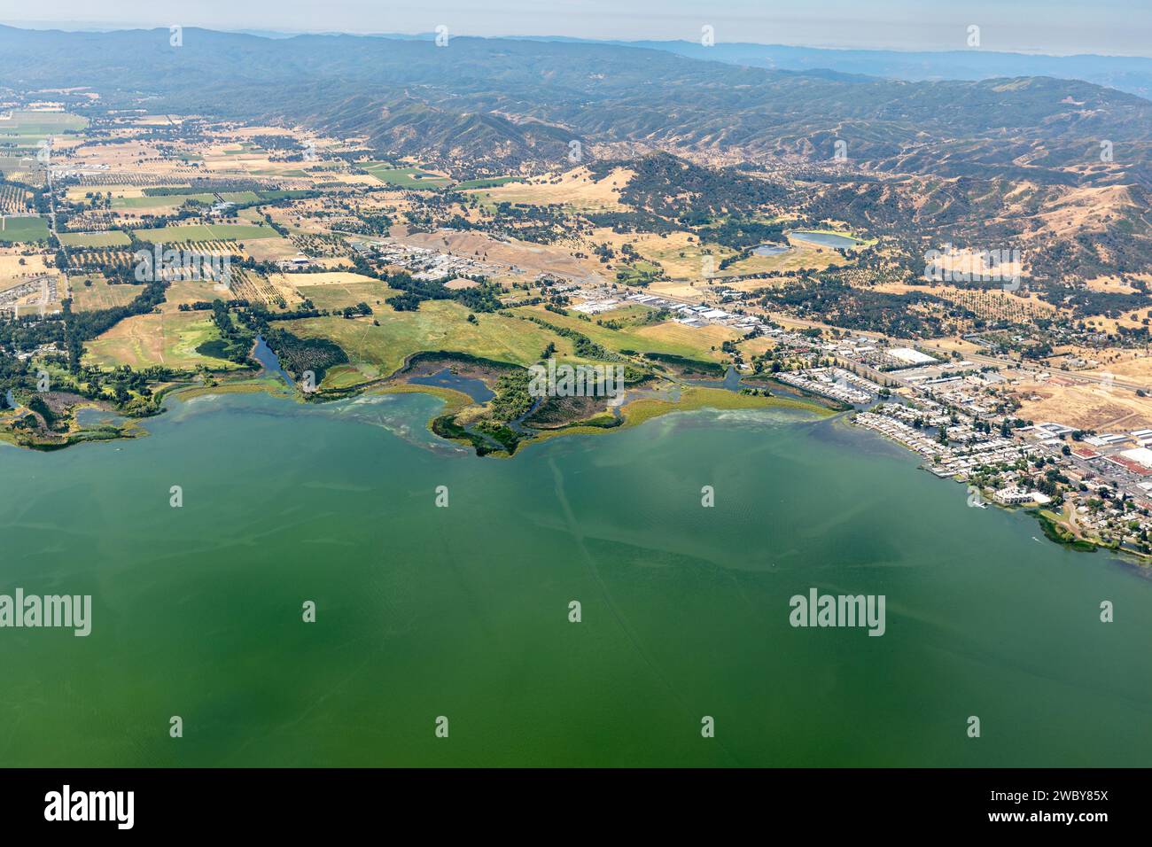 Aerial view of the polluted green waters of Clear Lake and the ...
