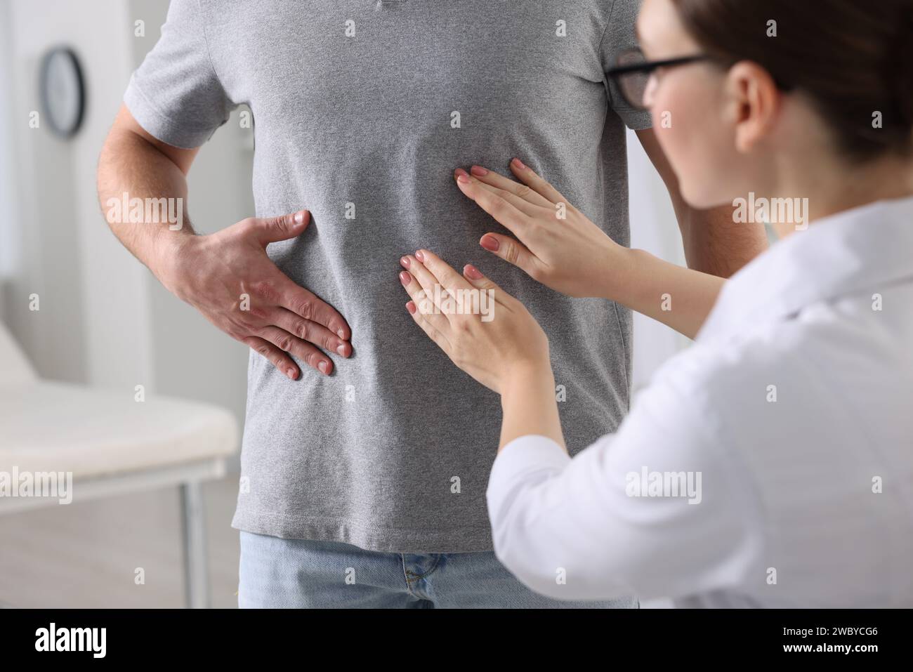 Gastroenterologist examining patient with stomach pain in clinic Stock ...