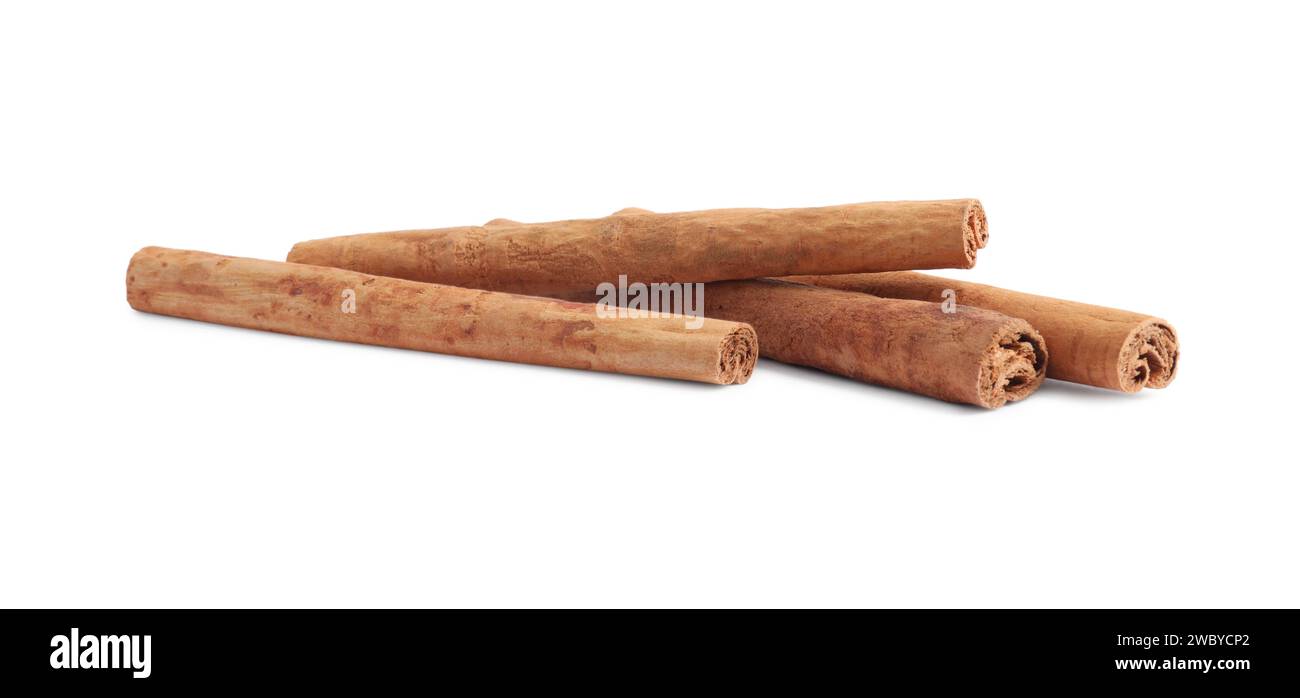 Dry aromatic cinnamon sticks isolated on white Stock Photo - Alamy
