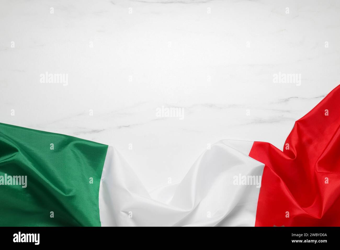 Flag of Italy on white marble background, top view. Space for text ...