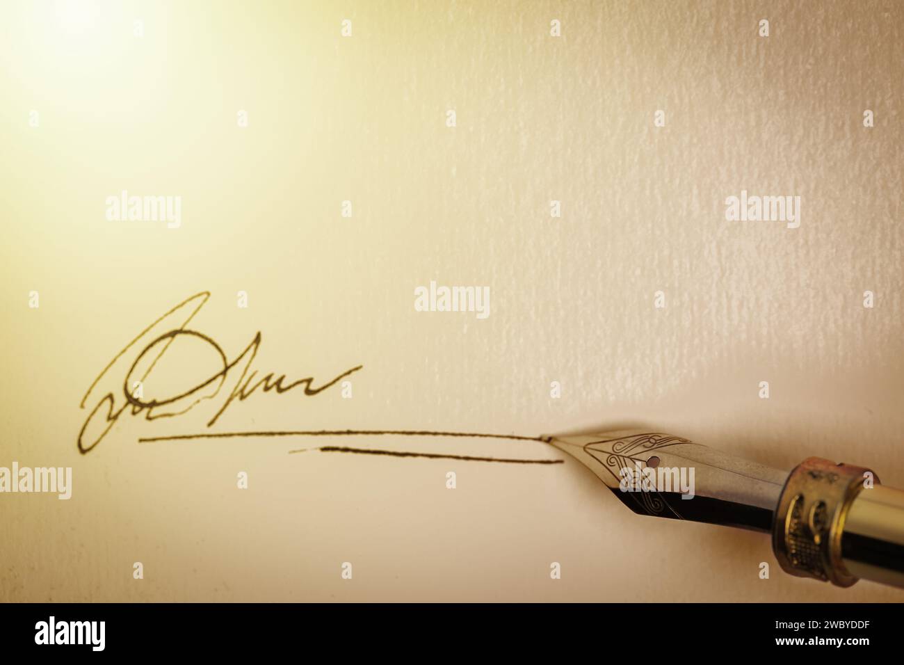 Signing on sheet of paper with fountain pen, top view. Space for text ...