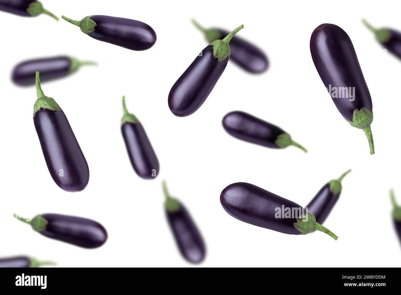 Fresh whole eggplants falling on white background Stock Photo - Alamy