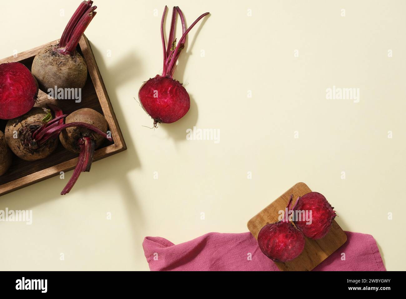 Fresh beetroot are decorated over pastel background with a towel in ...