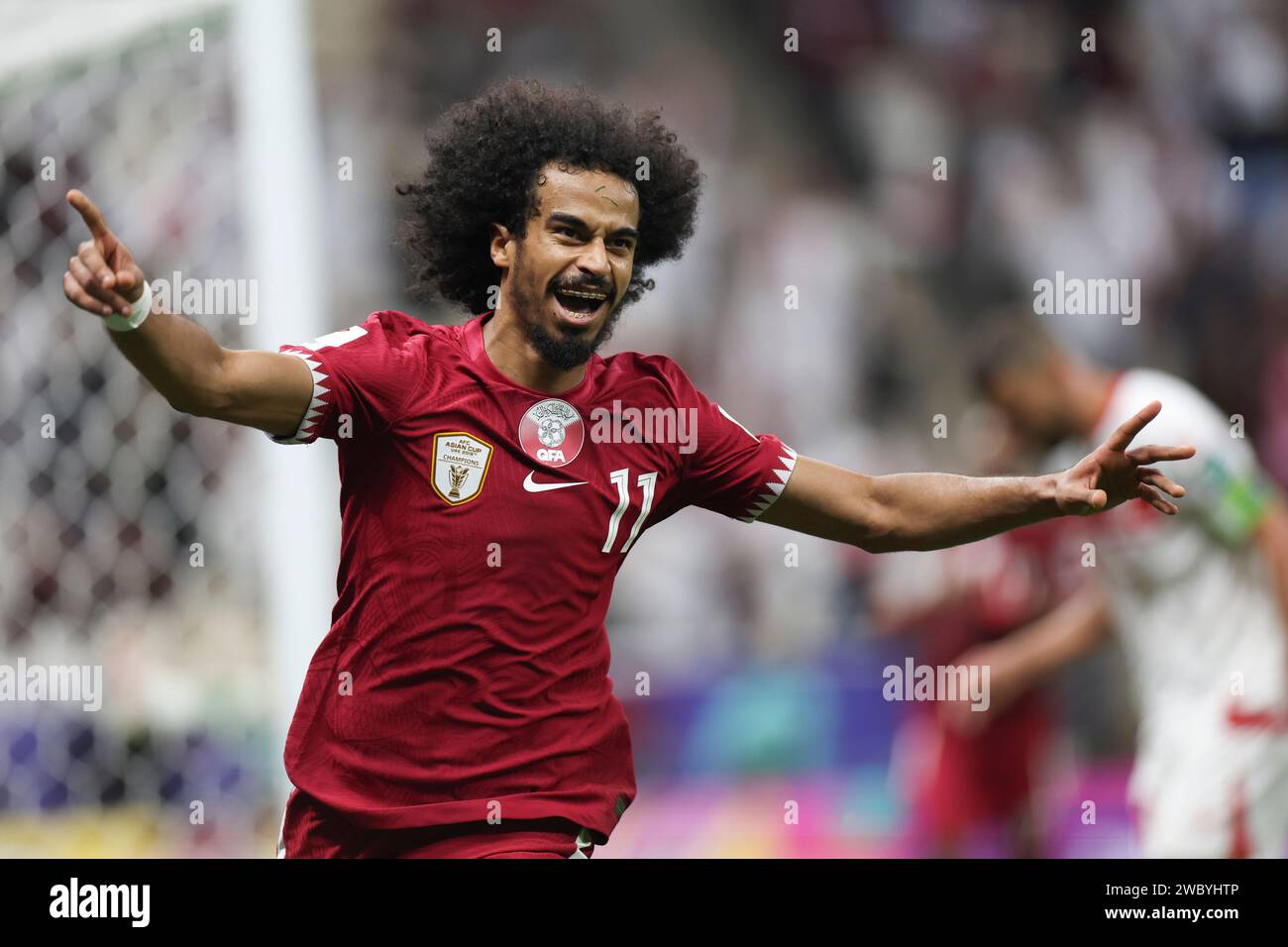 Beijing, Qatar. 12th Jan, 2024. Akram Afif of Qatar celebrates scoring ...