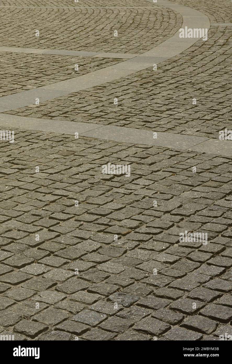 The texture of the paving slab (paving stones) of many small stones of ...