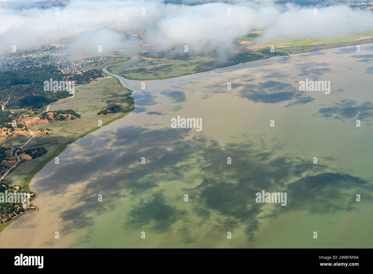 Aerial view of clouds over agricultural fields and northern San ...