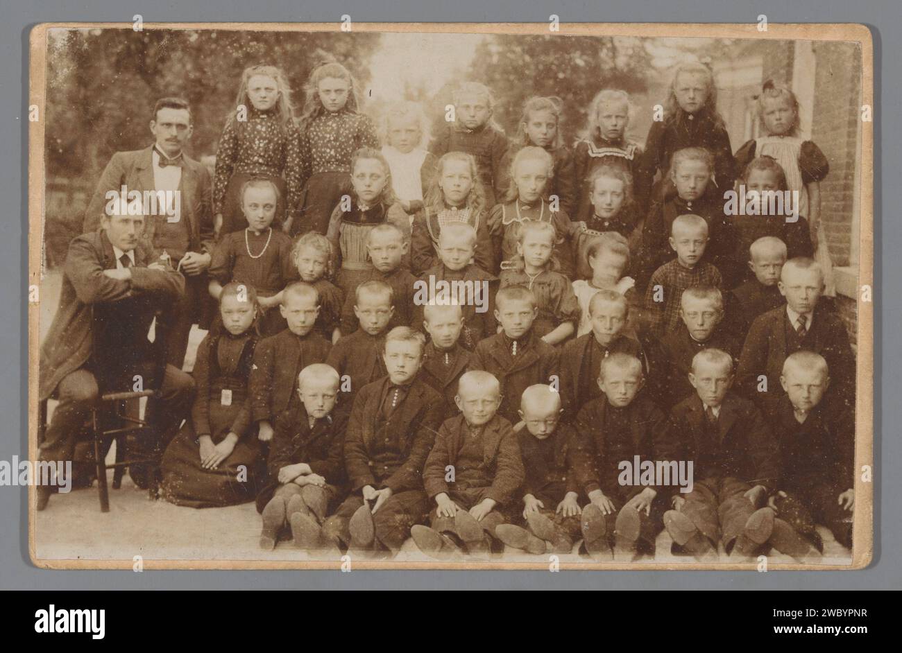School photo of children with two teachers, H.S. Frank, c. 1900 ...