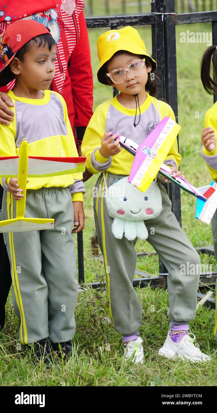 Kindergarten student play toy plane with friends Stock Photo - Alamy