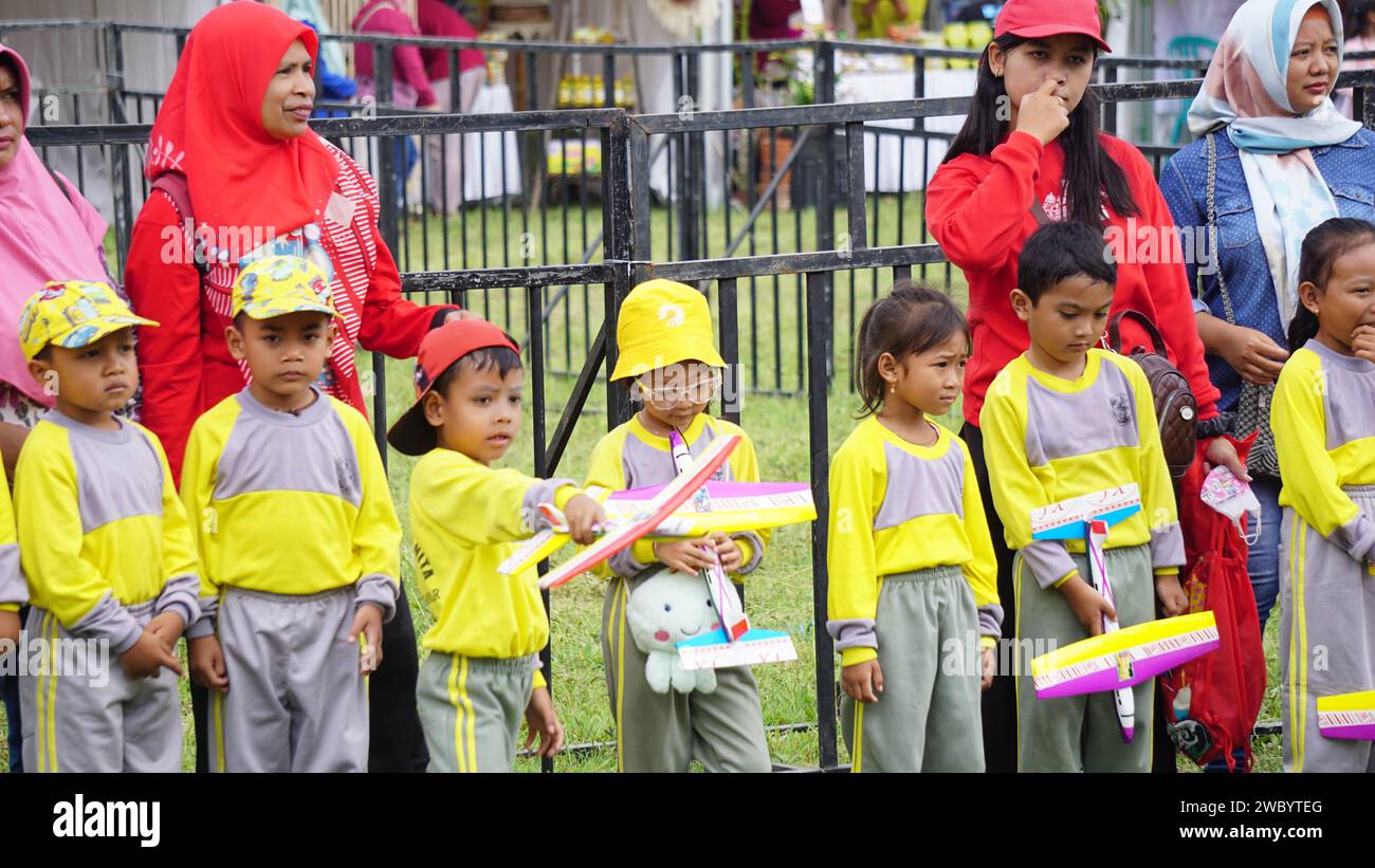 Kindergarten student play toy plane with friends Stock Photo - Alamy