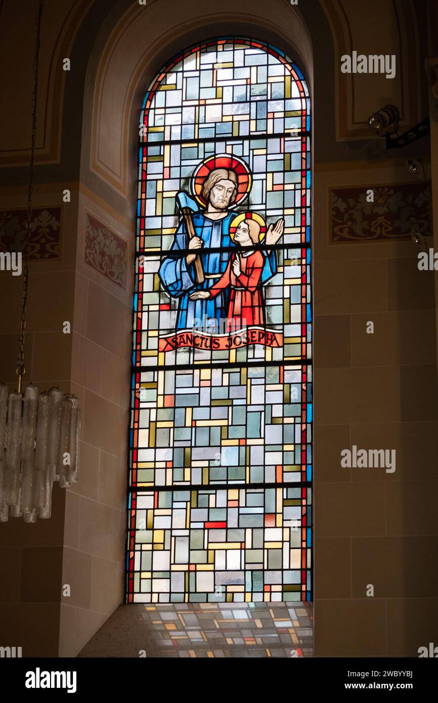 Saint Joseph with little Jesus. A stained-glass window in Église de la ...