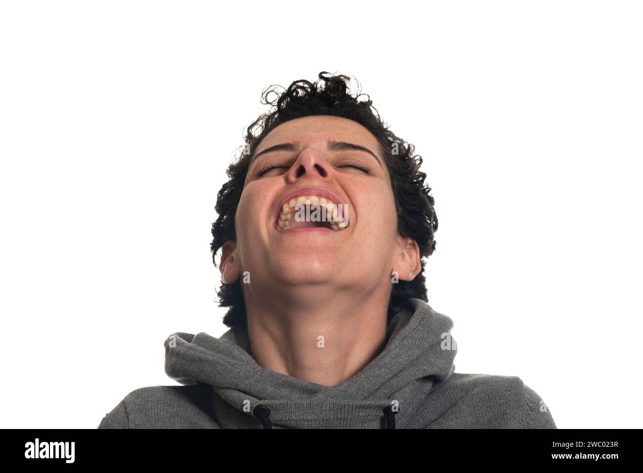 Woman laughing out loud against white background Stock Photo - Alamy