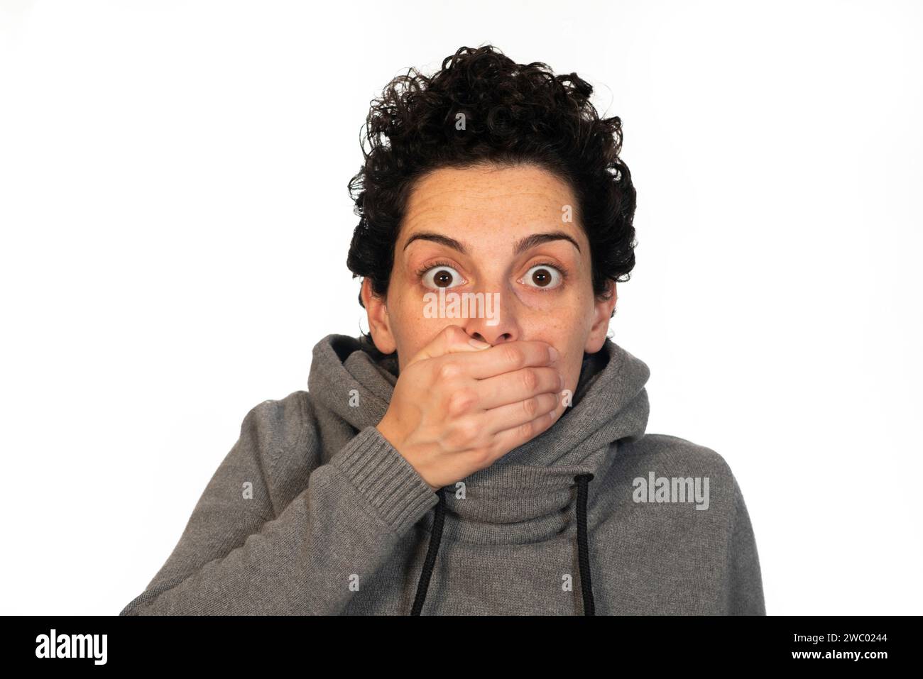 Shocked woman hand covering mouth Stock Photo - Alamy