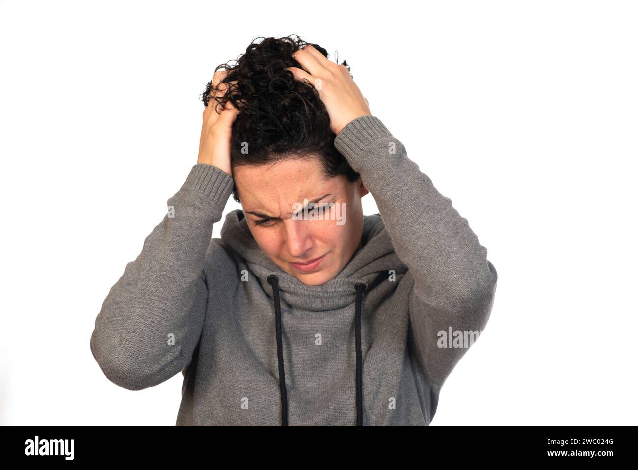 Woman hands scratching hair against white background Stock Photo - Alamy