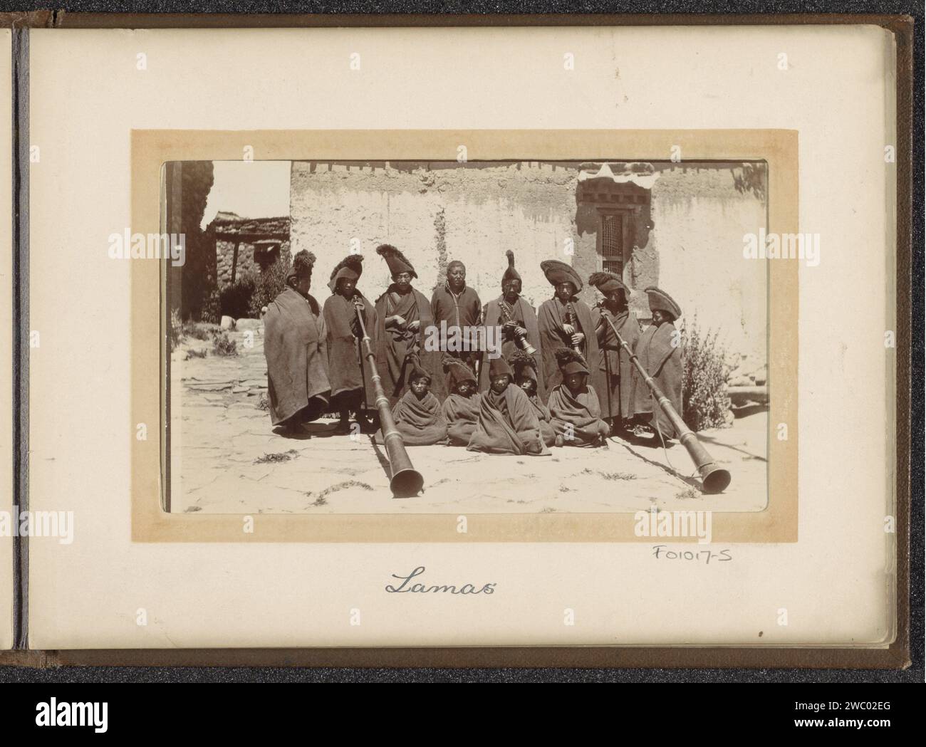 Group of Tibetan lamas with wind instruments (dunchen), Tibet, D.T ...