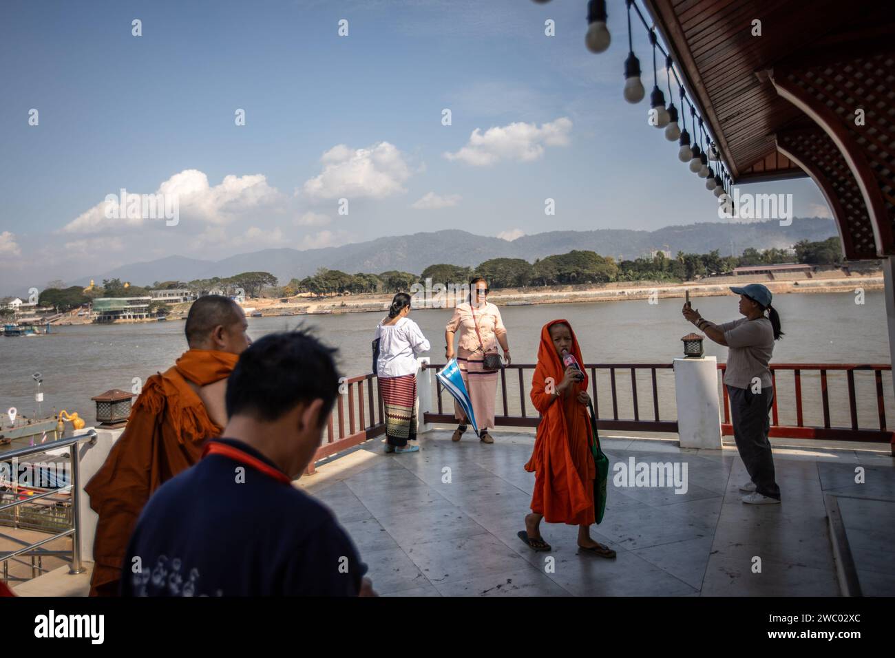 Chiang Saen, Thailand. 09th Jan, 2024. Local tourists and monks walks ...