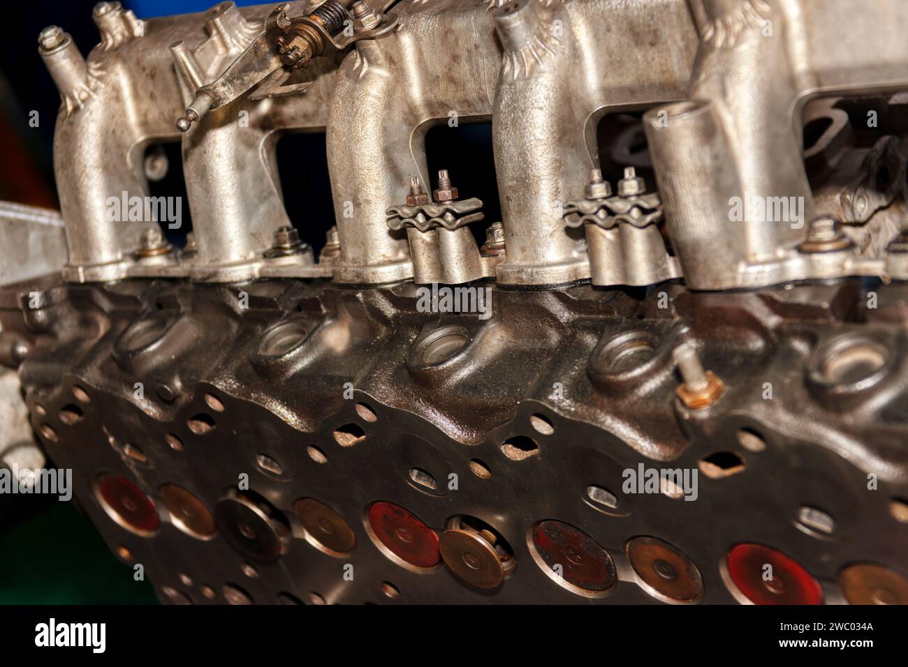 car cylinder head opened with the valves out, at an auto repair shop ...