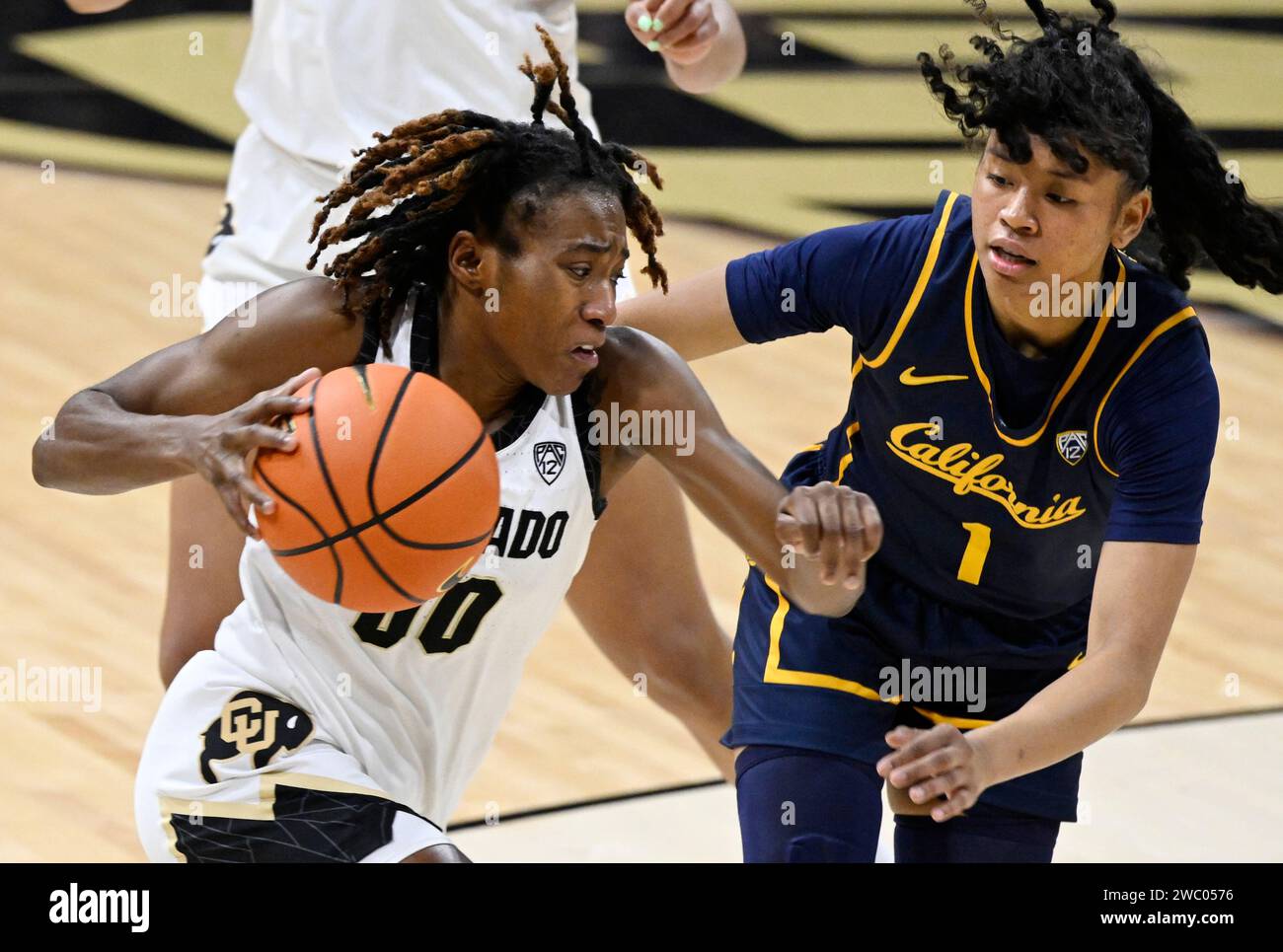 Colorado guard Jaylyn Sherrod, left, drives against California guard ...