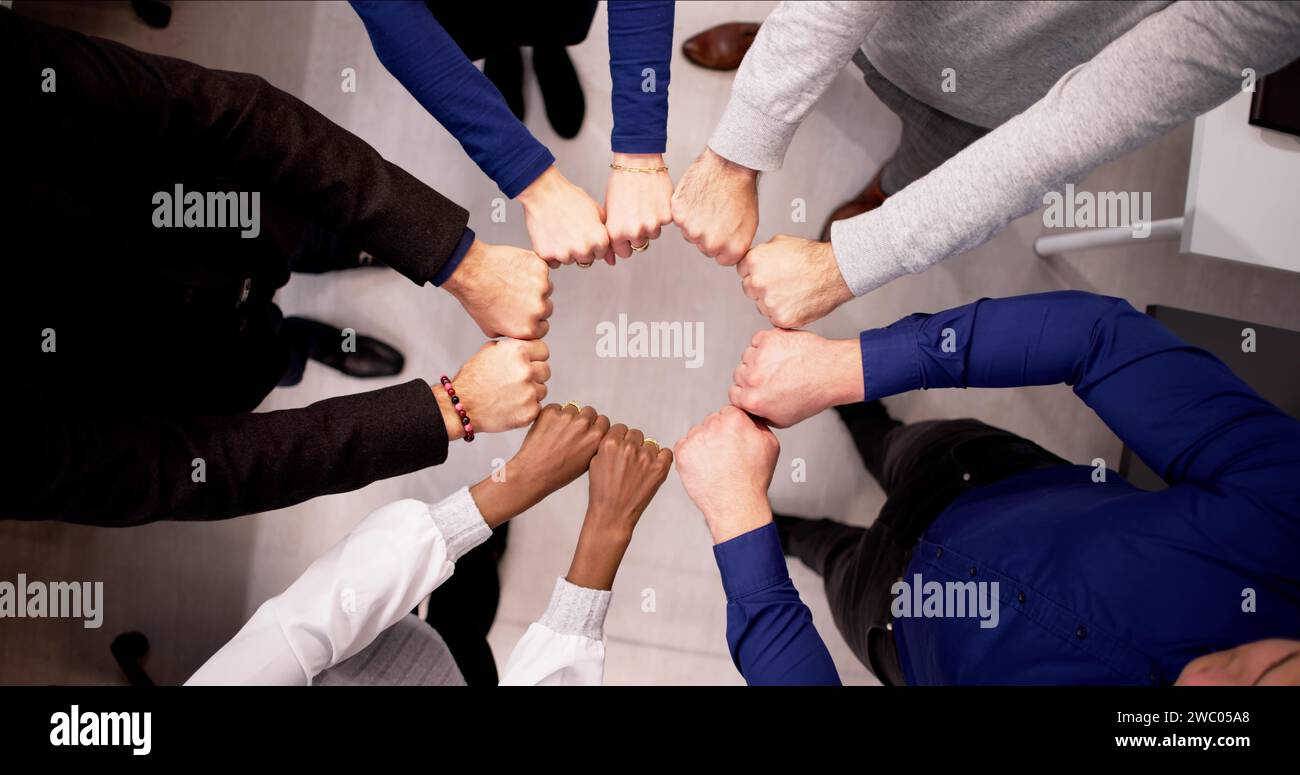 Black hands group fist bump hi-res stock photography and images - Alamy
