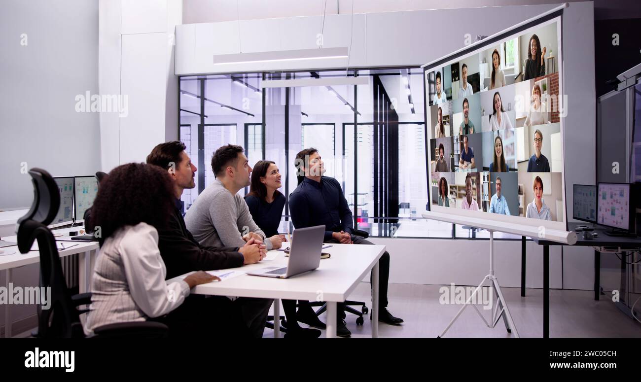 Online Video Conference Call In Boardroom Meeting Stock Photo - Alamy