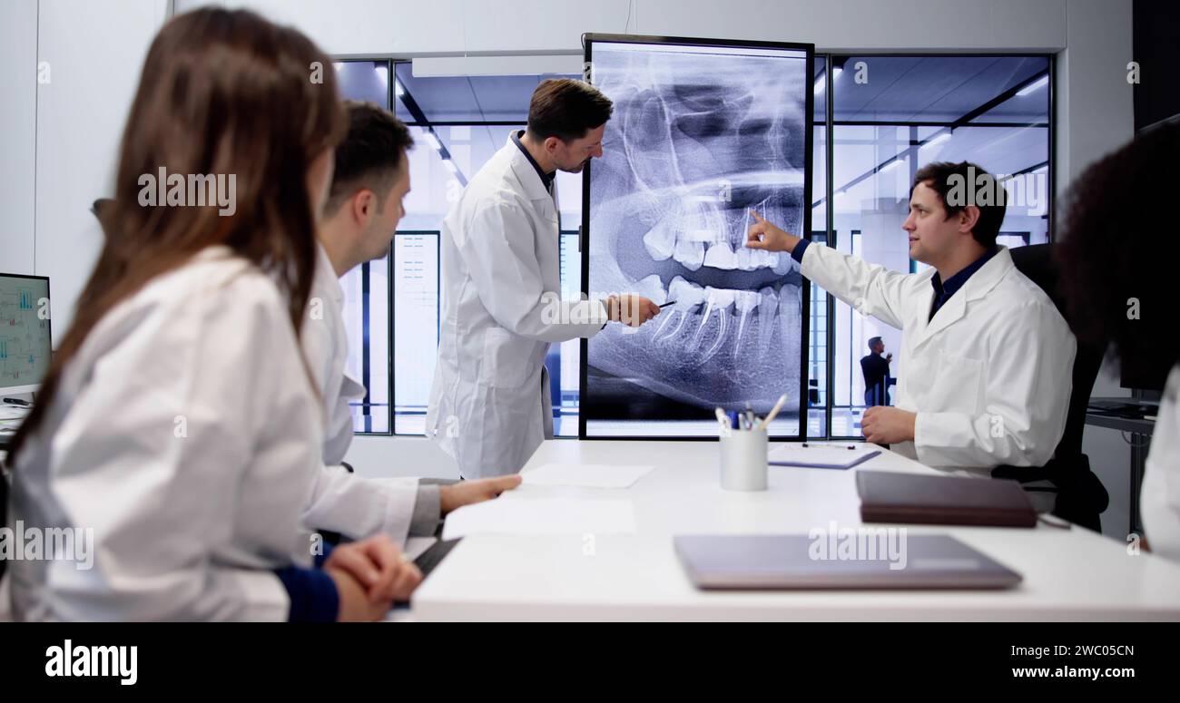 Dentist Doctor Looking At Teeth Xray Using Computer Software Stock ...