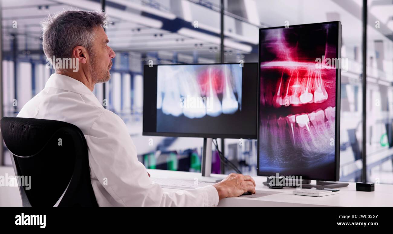 Radiologist Dentist Using X Ray Software On Desktop Computer Stock ...