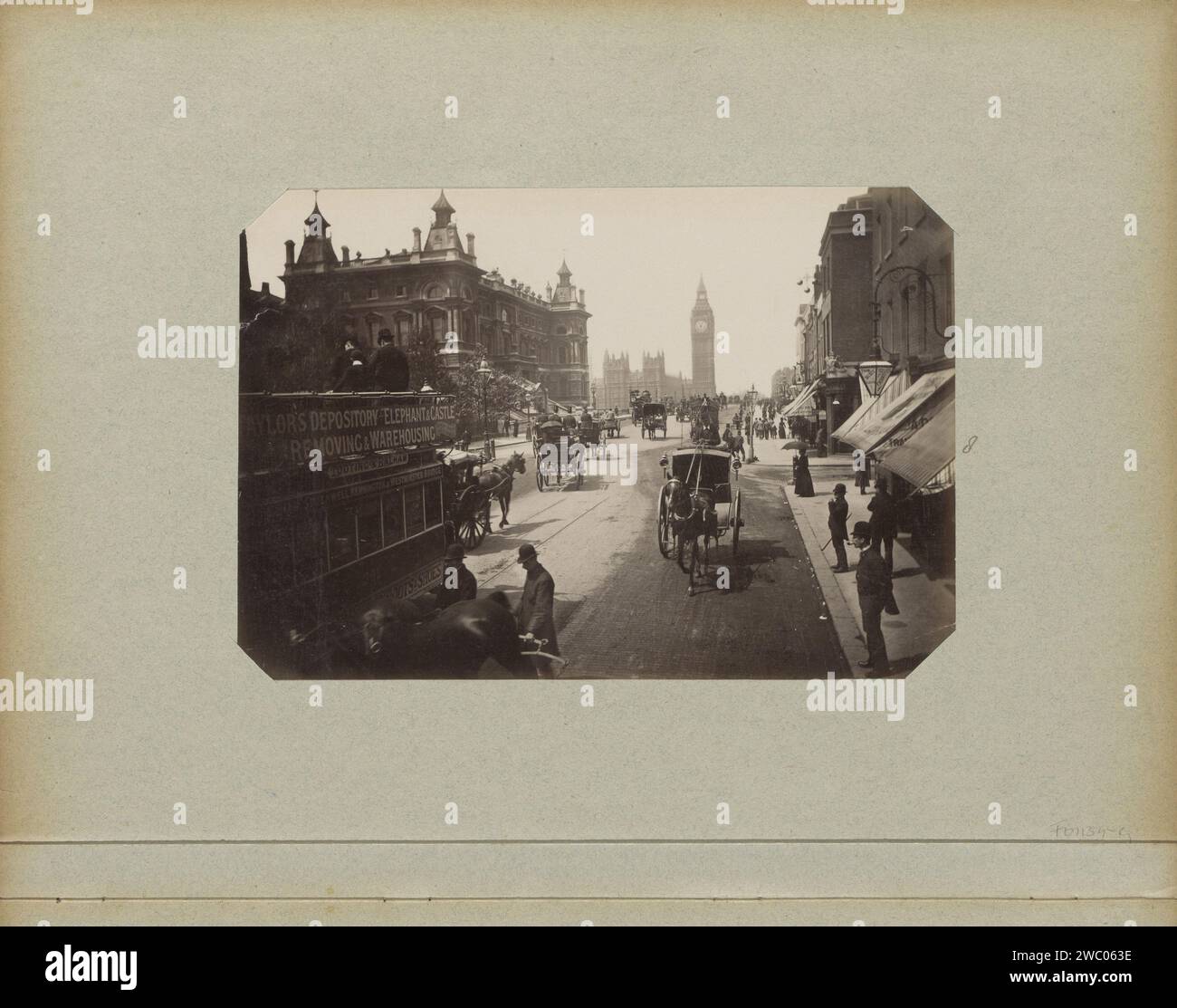 Westminster Bridge Road with horse carriages and passers -by, seen towards Houses of Parliament ...