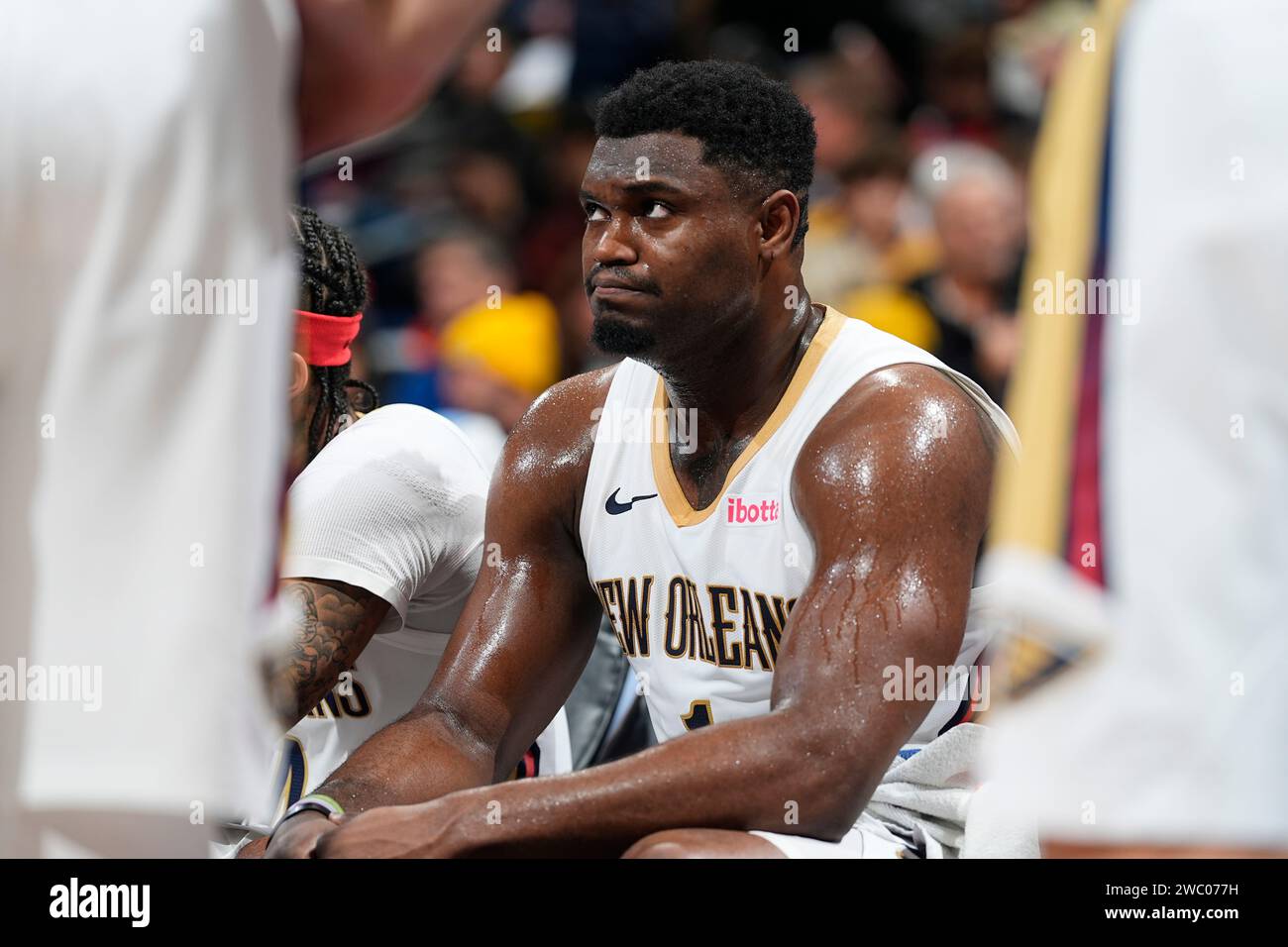 New Orleans Pelicans forward Zion Williamson sits on the bench during a ...