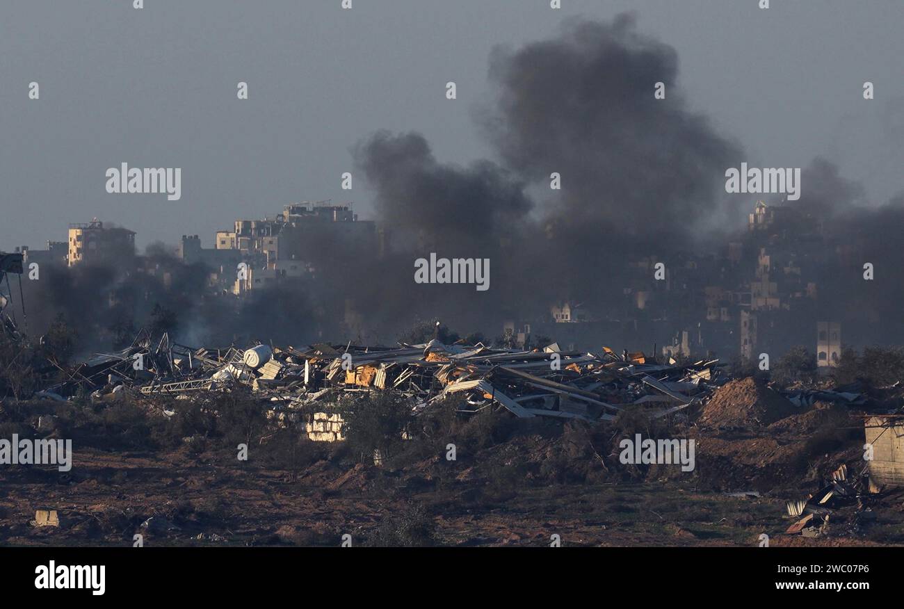 A massive smoke billows after an Israeli strike on Shejaiya a ...