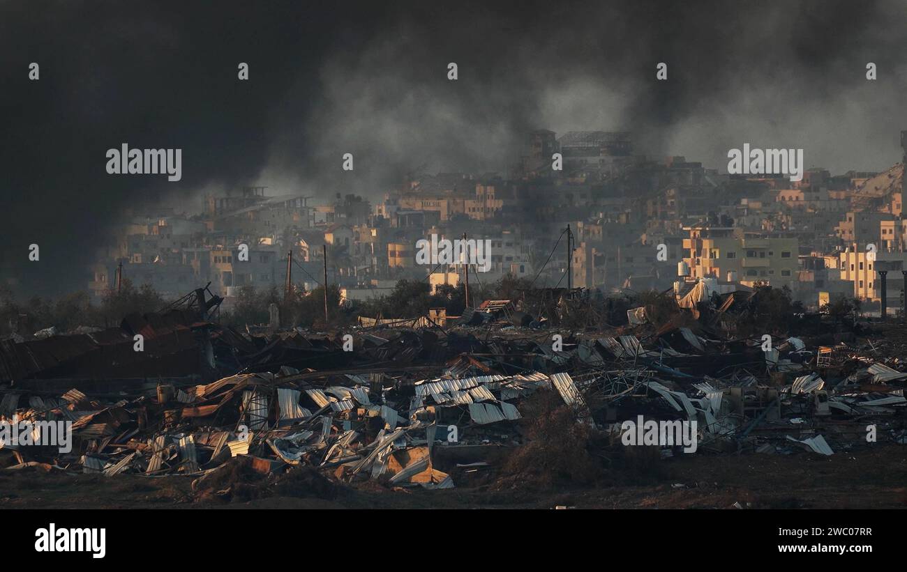A massive smoke billows after an Israeli strike on Shejaiya a ...