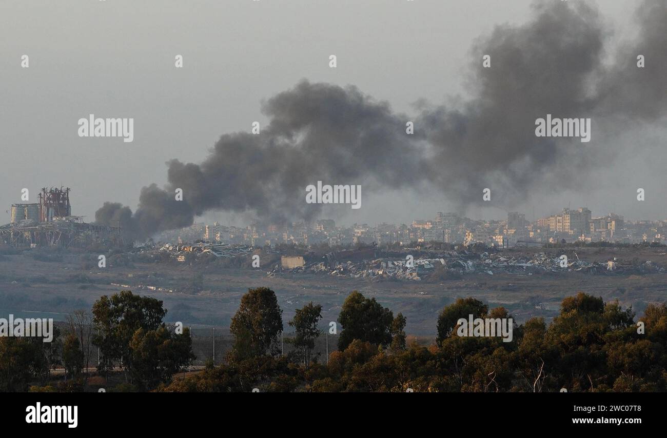 A massive smoke billows after an Israeli strike on Shejaiya a ...