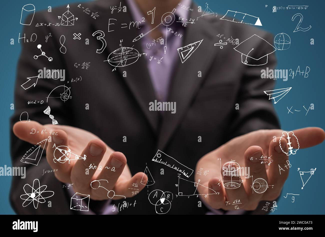 Male hand writing mathematical formulas on blurry background. Science ...