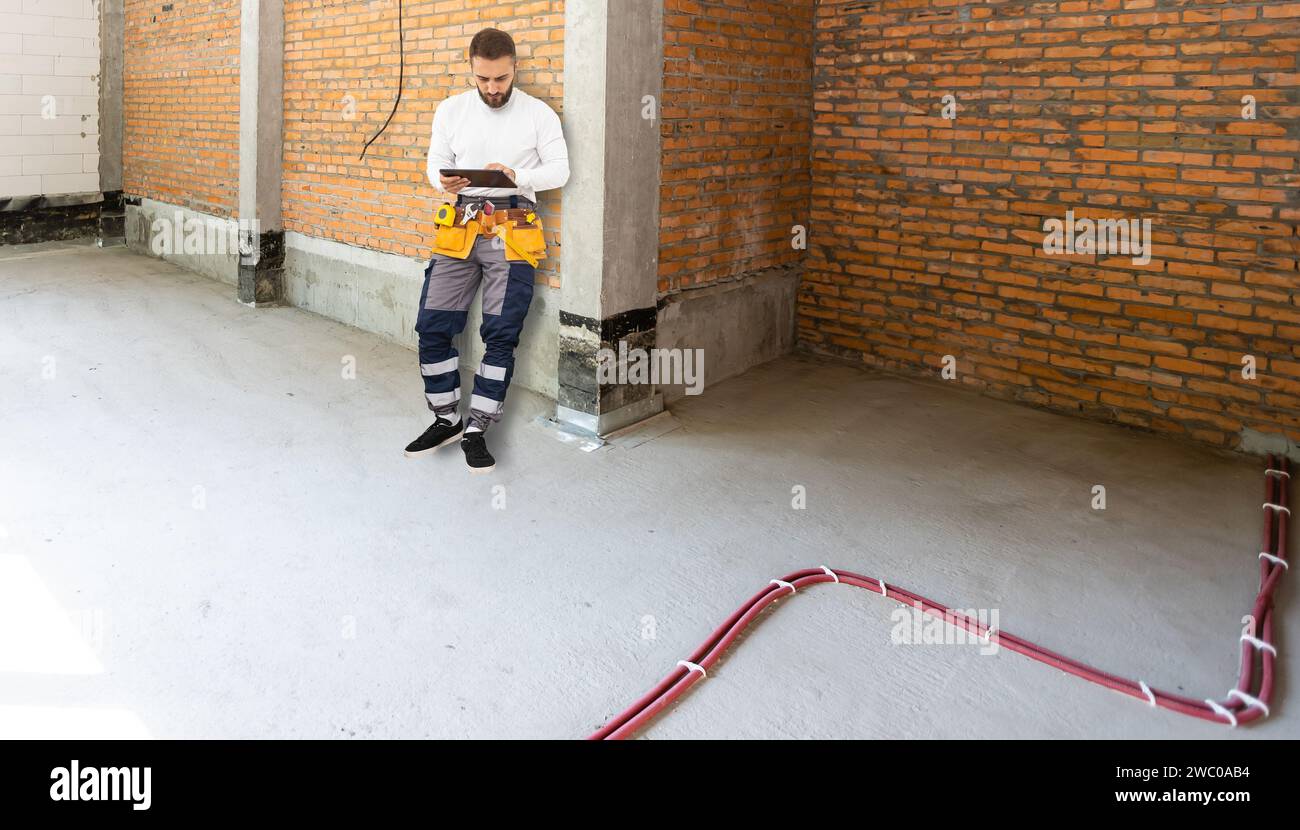 Builder handyman with construction tools. House renovation background ...
