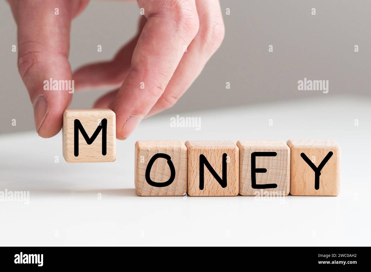 Spend or make money symbol. Businessman turns cubes and changes concept ...